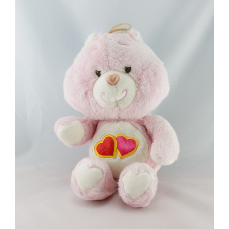 Peluche Bisounours rose Groschéri avec 2 coeurs CARE BEARS